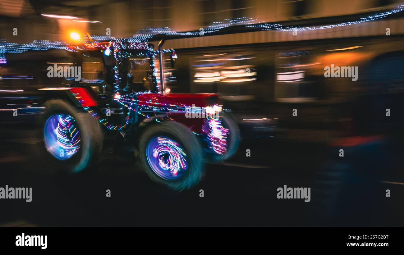 Tractor decorated with festive lights at the Christmas Charity Tractor ...