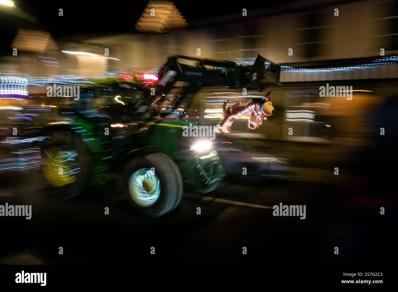 Tractor decorated with festive lights at the Christmas Charity Tractor ...