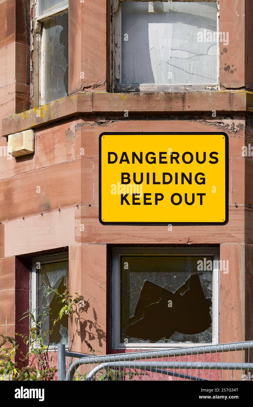 Dangerous building keep out sign on building ready to be demolished ...