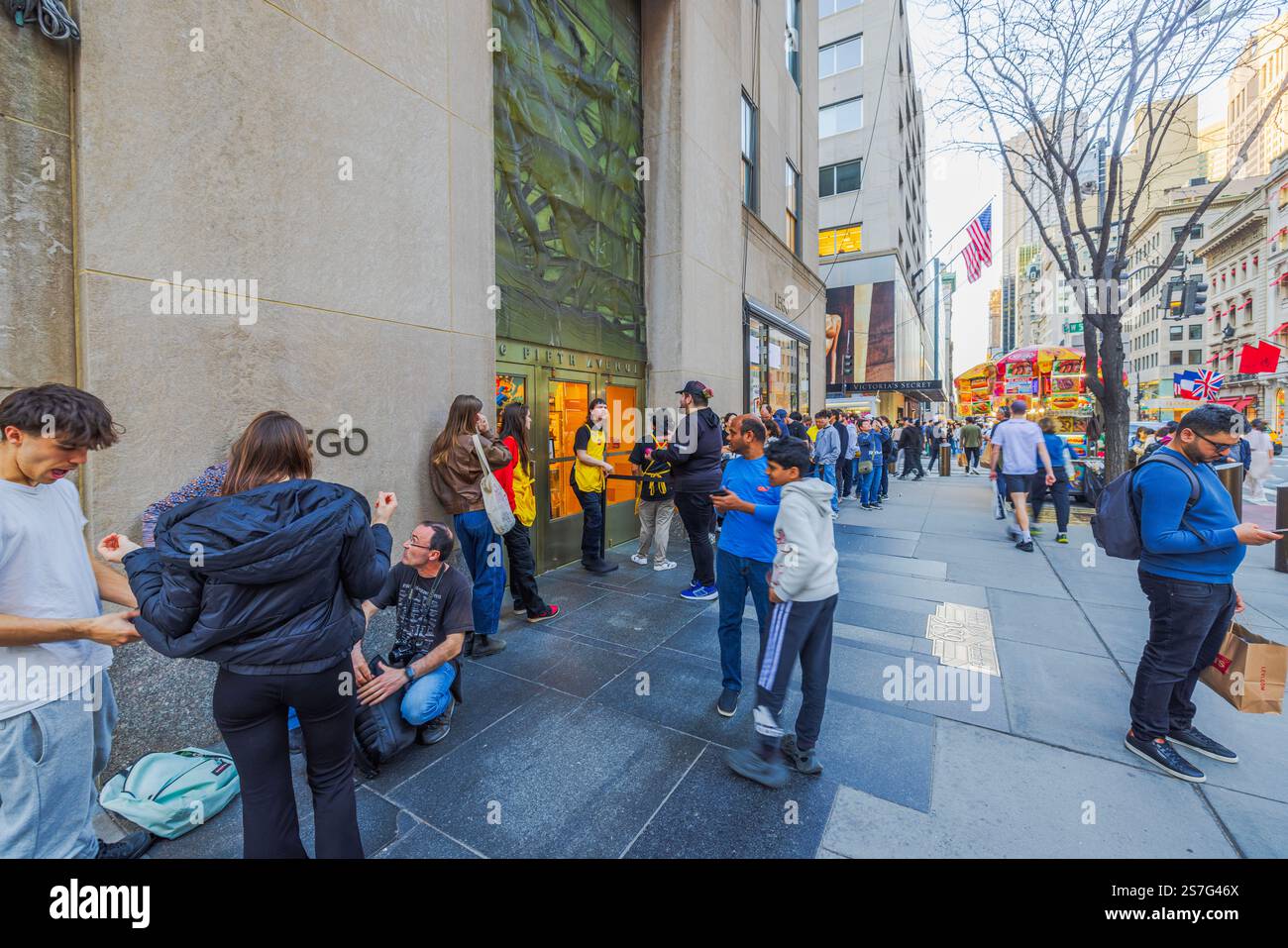 Crowd of people waiting in line outside LEGO store on Fifth Avenue in ...