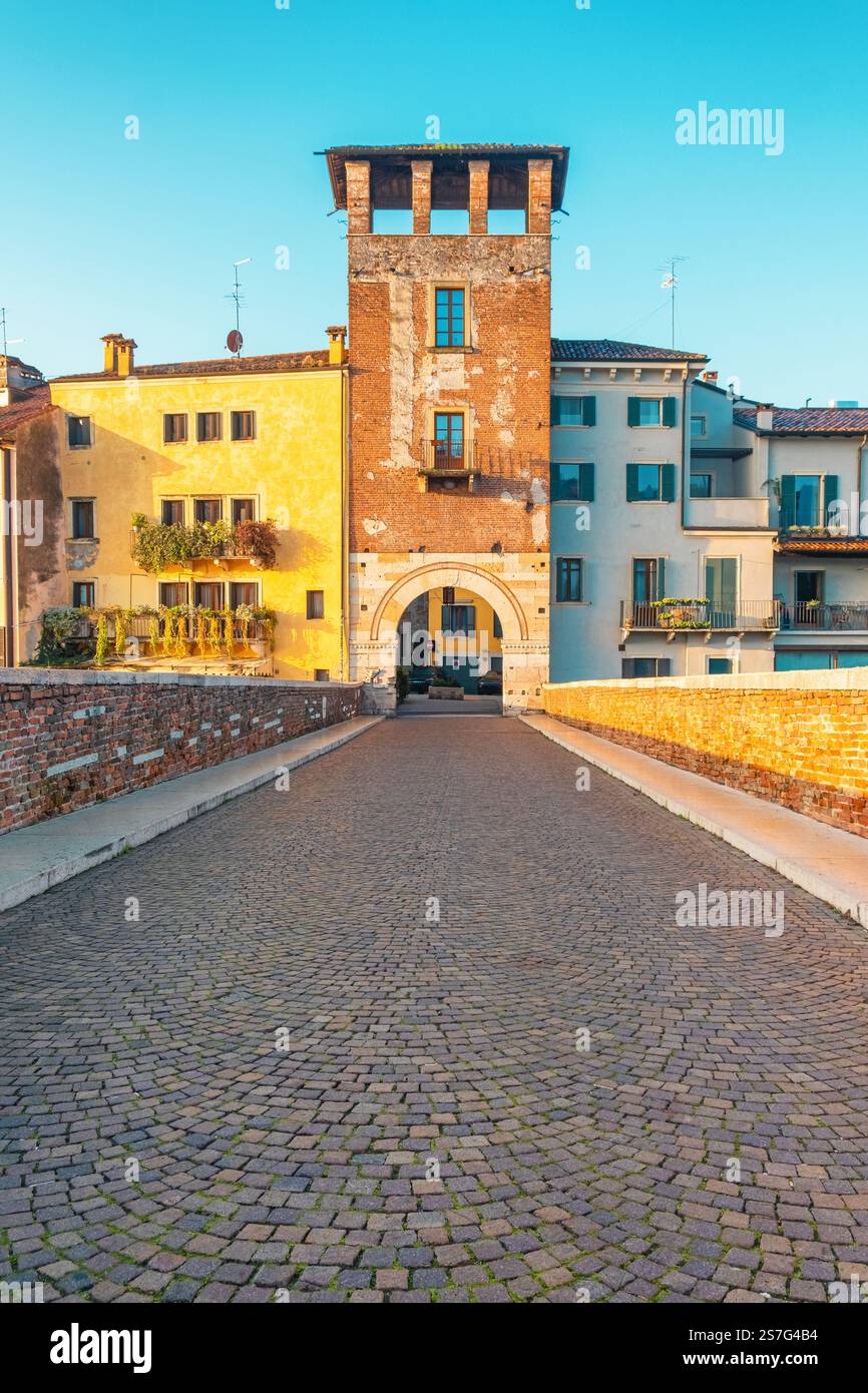 Entrance to Ponte Pietra historic Roman arch bridge in Verona across ...