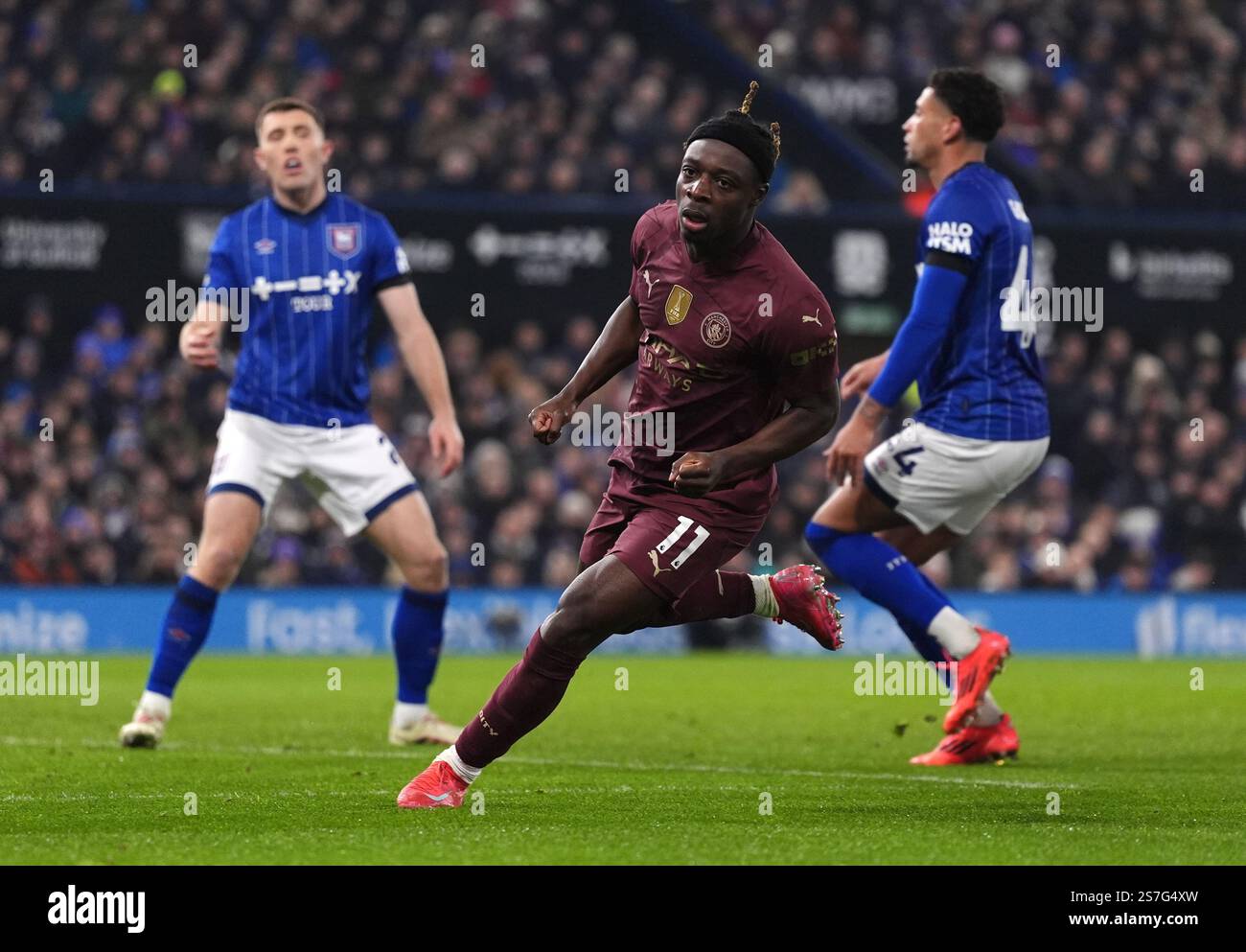 Manchester City's Jeremy Doku celebrates scoring their side's fourth ...