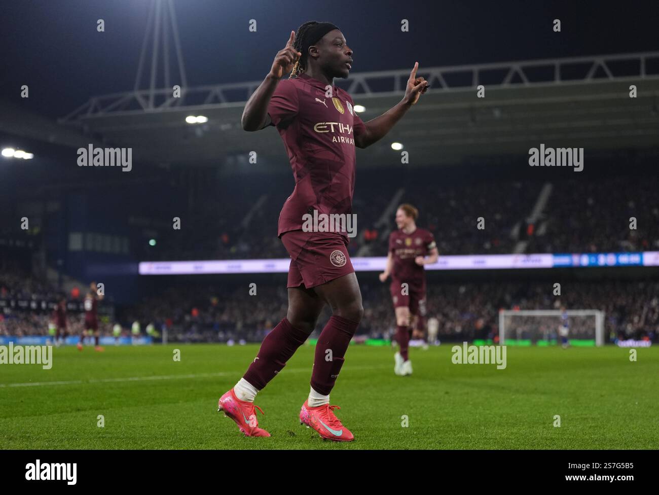 Manchester City's Jeremy Doku celebrates scoring their side's fourth ...