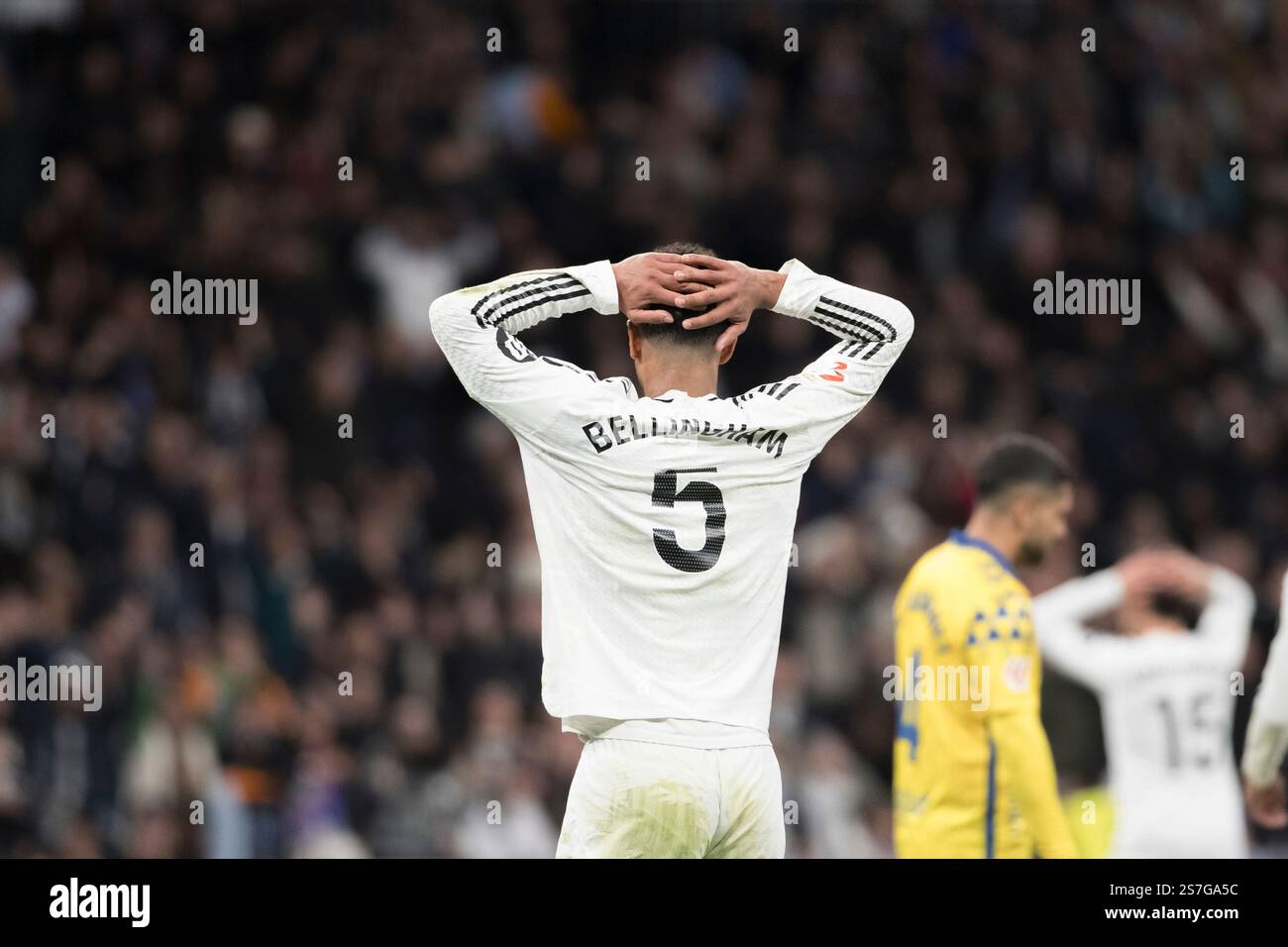 MADRID, SPAIN - January 19: Jude Bellingham of Real Madrid puts his ...
