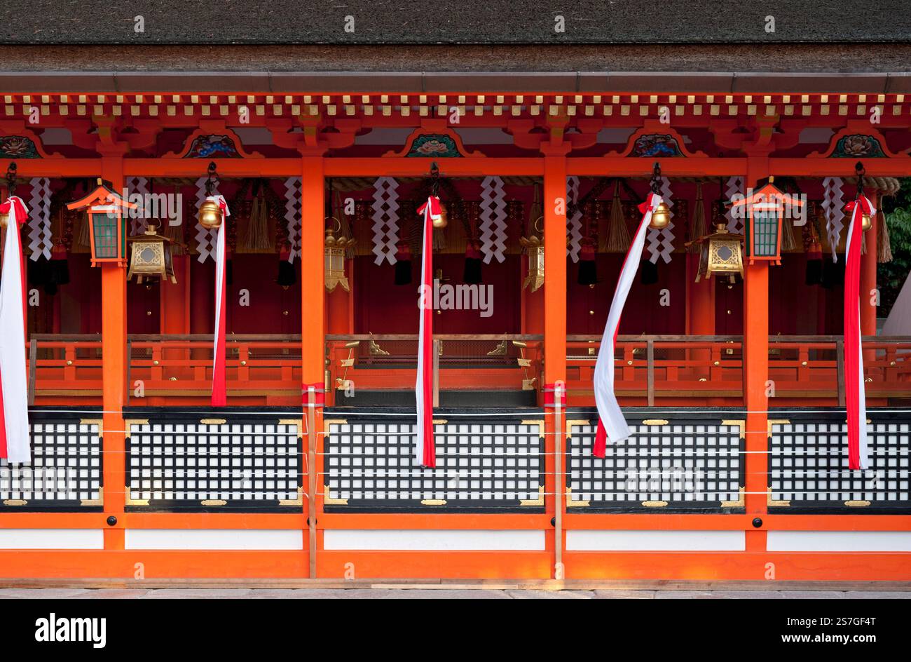 Red and white streamers hanging from "suzu" (shrine bells) used to ...
