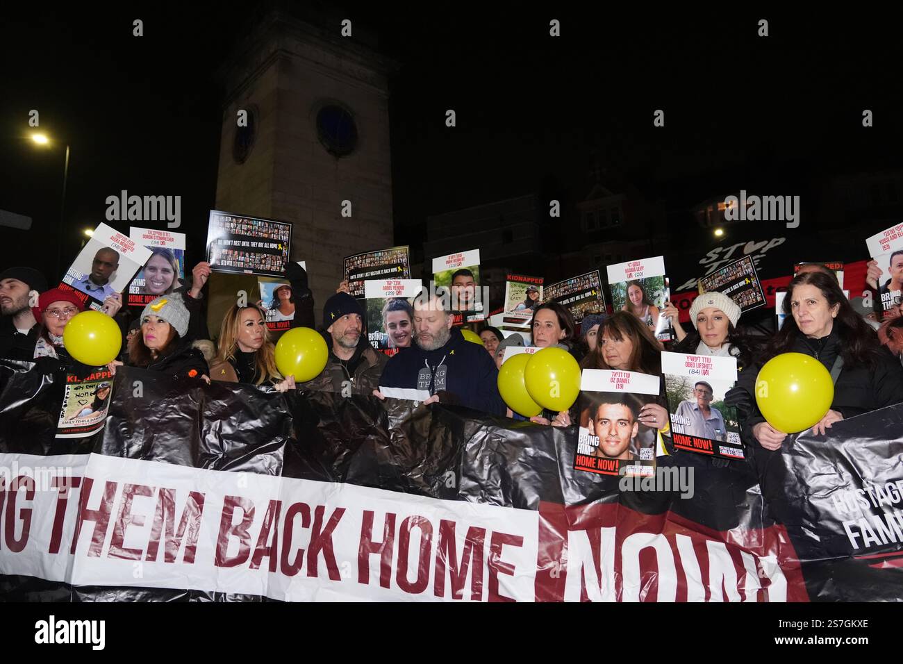 People at a gathering at the Golders Green War Memorial, London, to ...