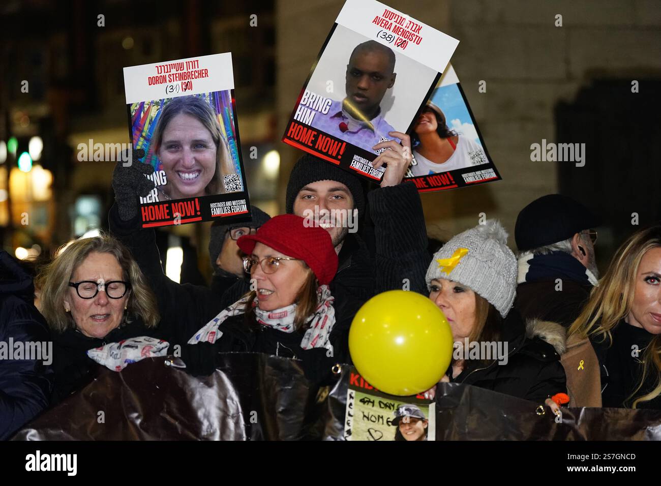 People at a gathering at the Golders Green War Memorial, London, to ...