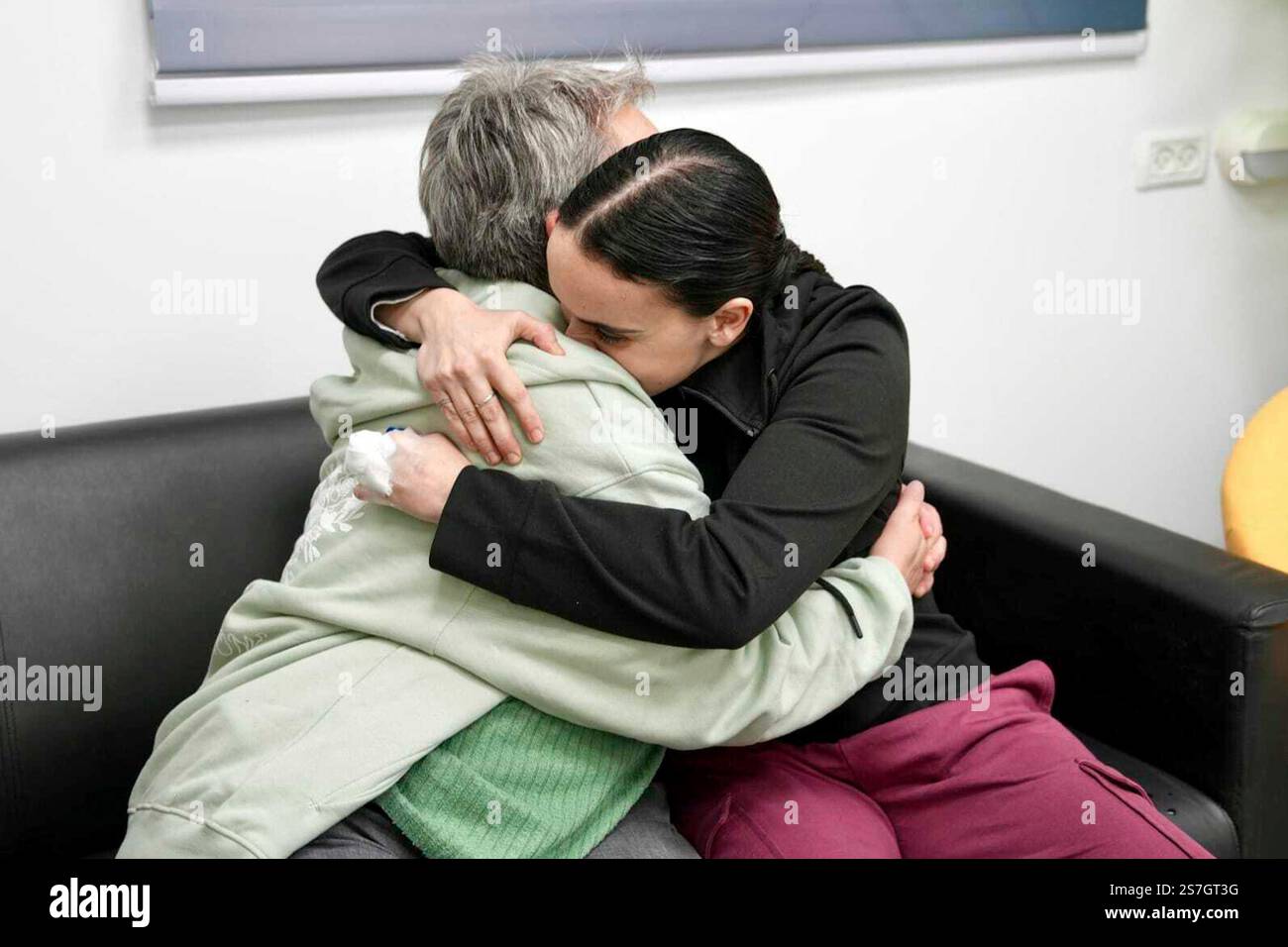 In this photo released by the Israeli Army, Emily Damari, right, and ...