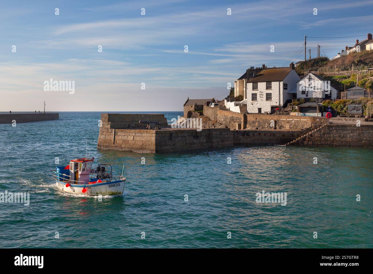 BM39 entering Porthleven Harbour by The Ship Inn on a bright autumn day ...