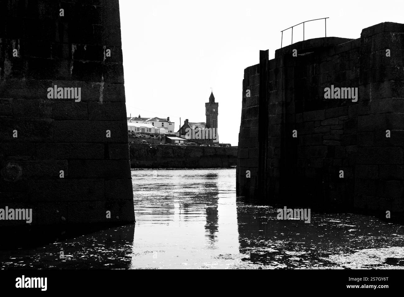 Porthleven Clocktower through the harbour wall | Cornwall | black and ...
