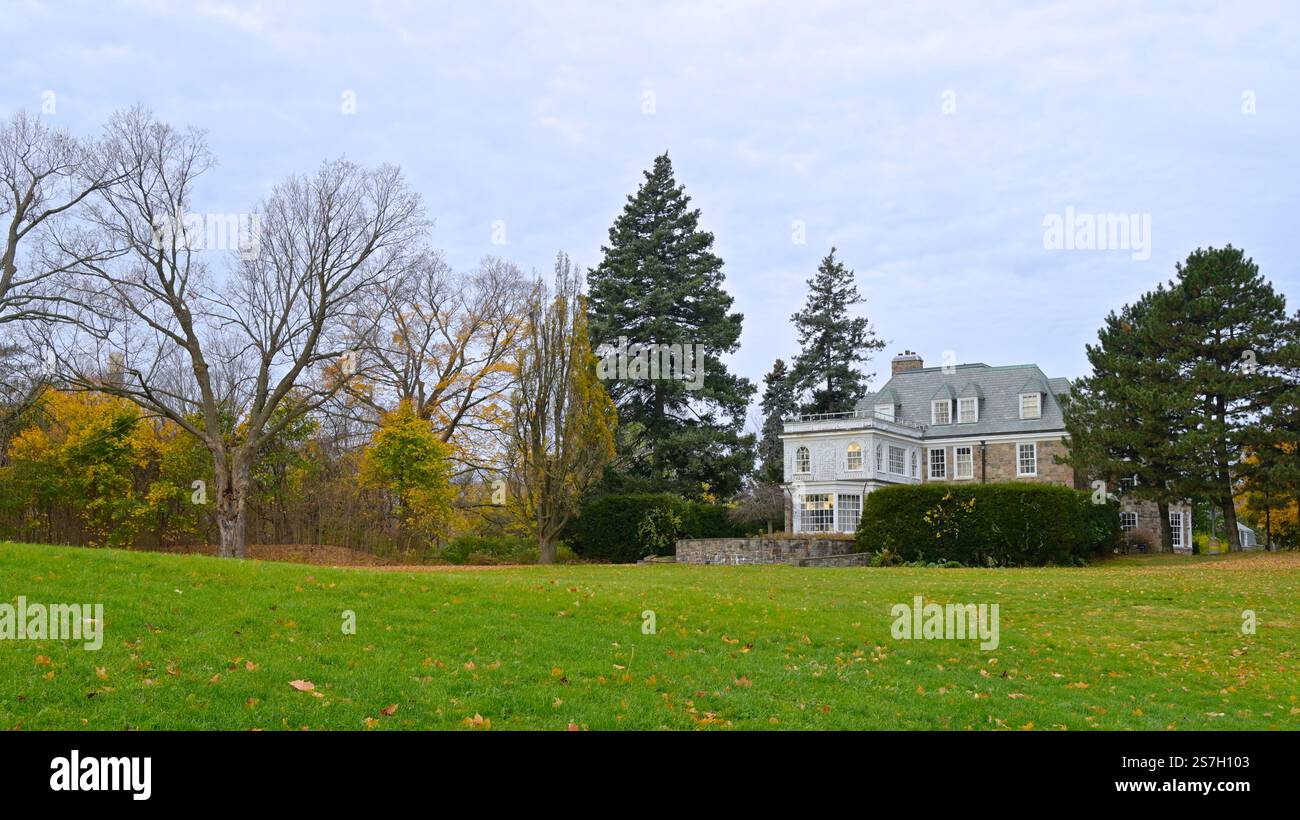 A historical mansion with a beautifully landscaped back yard with ...