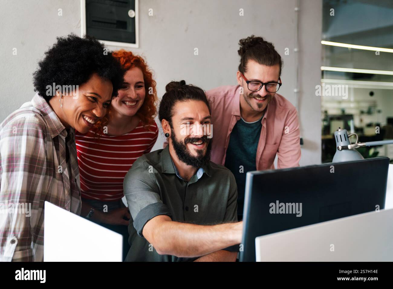 Mixed team of software engineers brainstorming ideas. Diverse app developers collaborating as ...