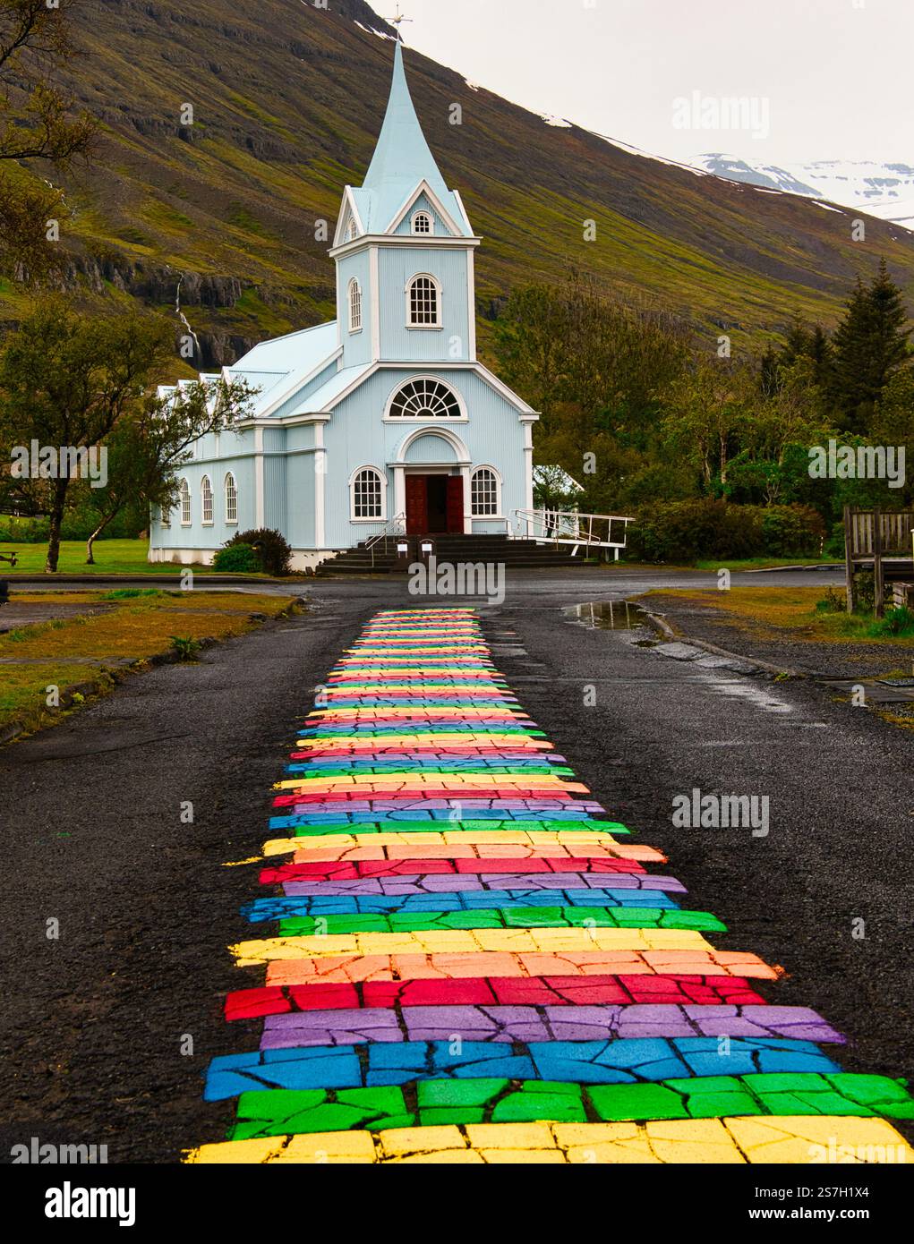 Icelandic Church with rainbow path Stock Photo - Alamy