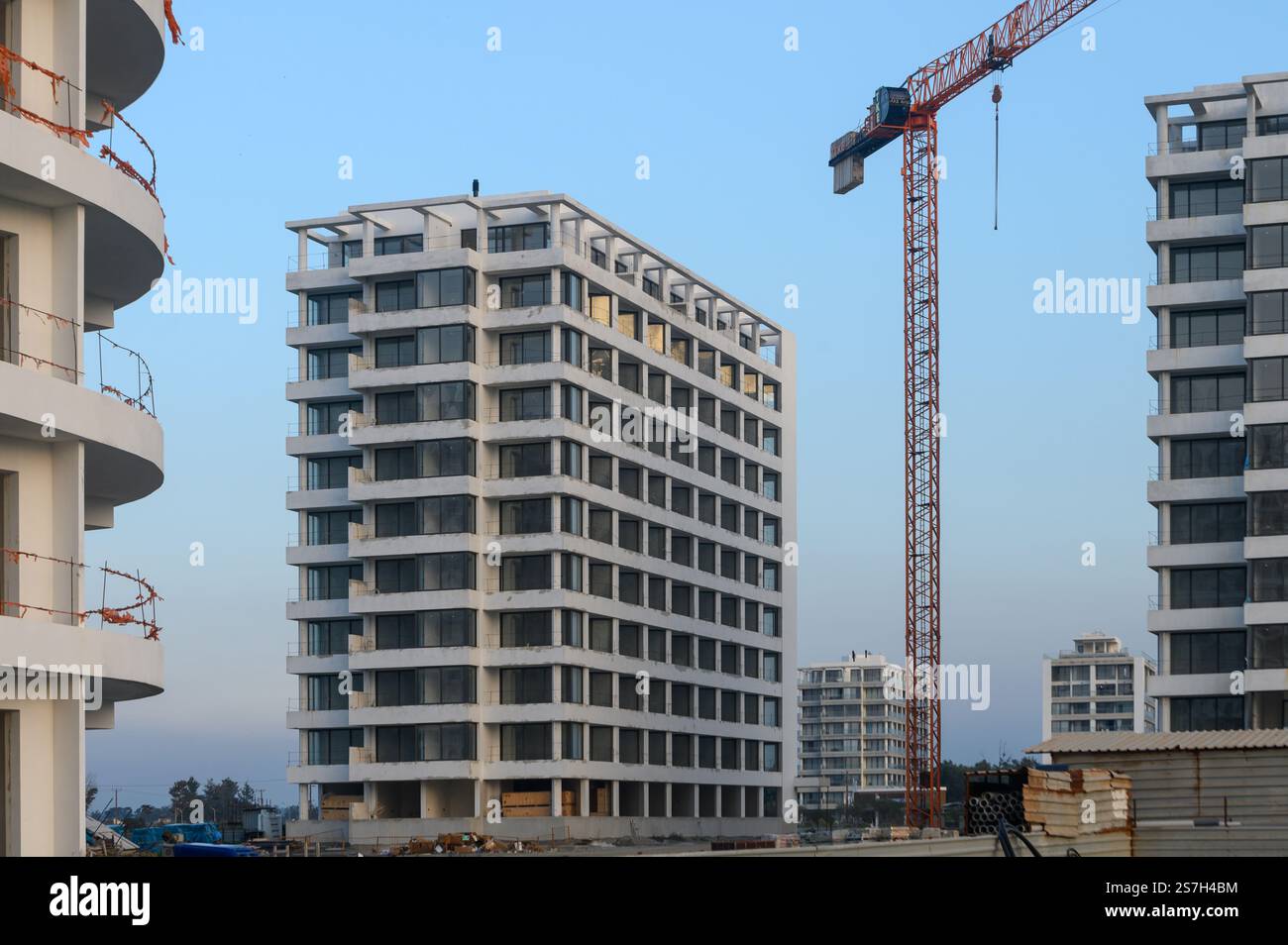 New residential buildings emerge against a twilight sky, showcasing ...