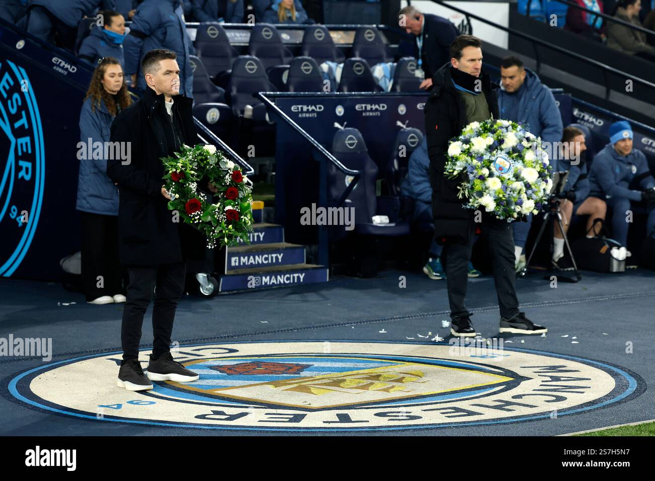 Manchester United manager Marc Skinner (left) and Manchester City ...