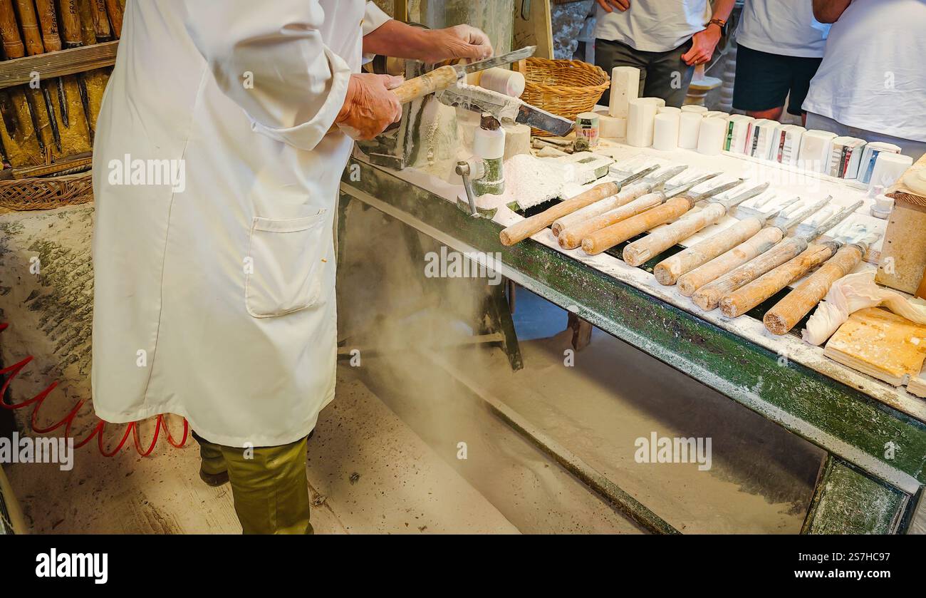 Sculptor and carver in work progress at a workshop of gypsum alabaster ...