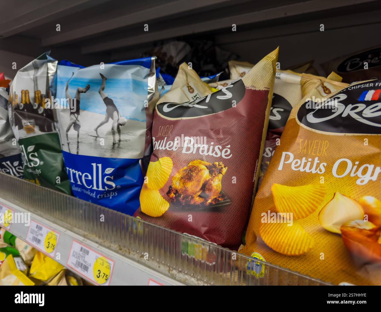 Crunchy snack selection displayed on a grocery shelf in a store Stock ...