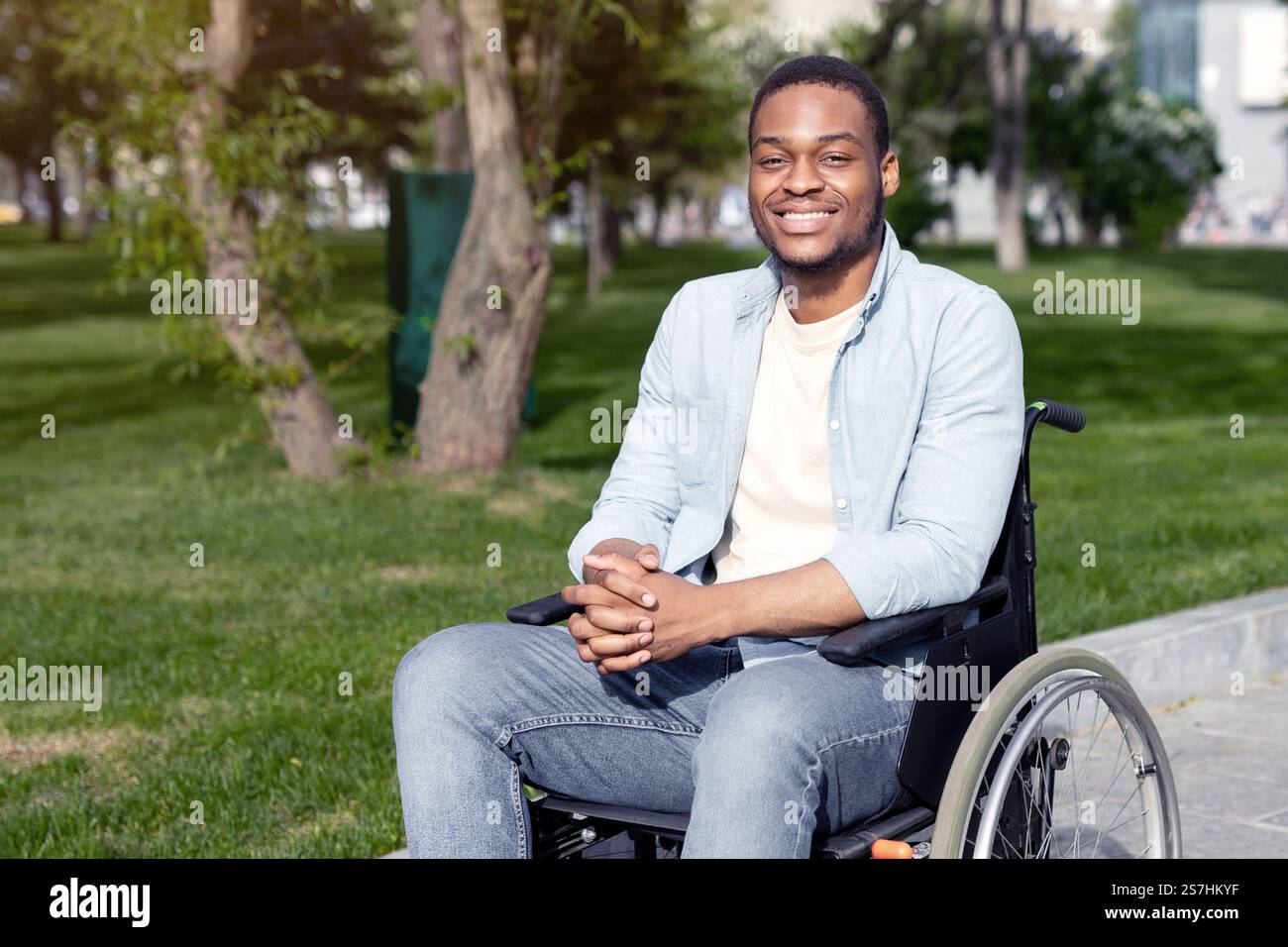 Accessible environment for disabled people concept. Happy black guy in ...
