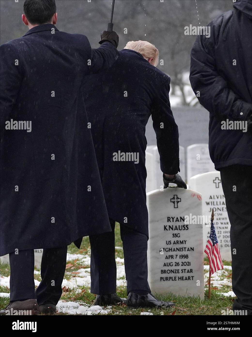 President-elect Donald Trump touches the headstone of Army Staff Sgt ...