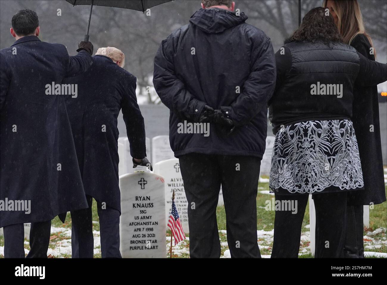 President-elect Donald Trump touches the headstone of Army Staff Sgt ...