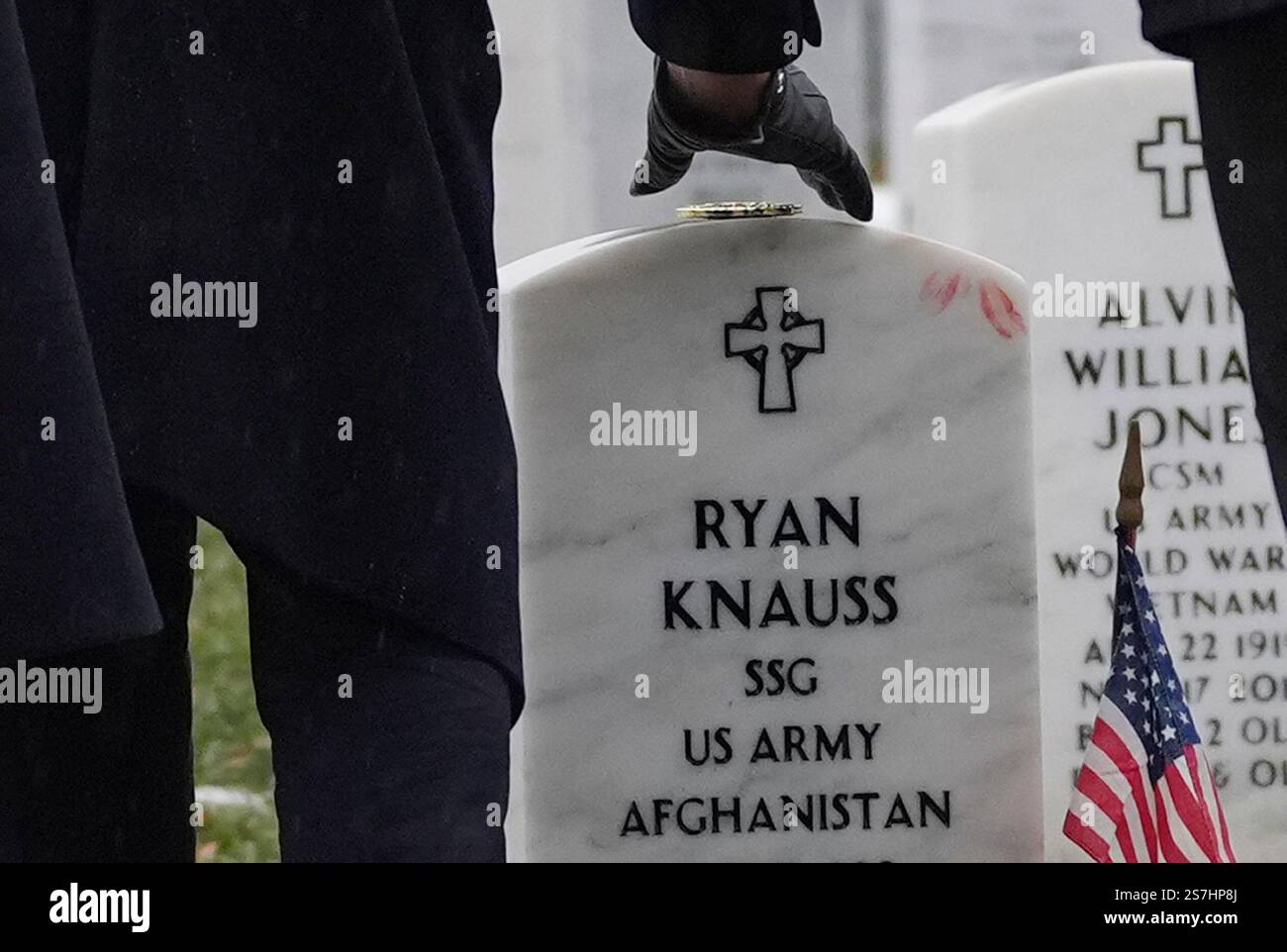 President-elect Donald Trump touches the headstone of Army Staff Sgt ...
