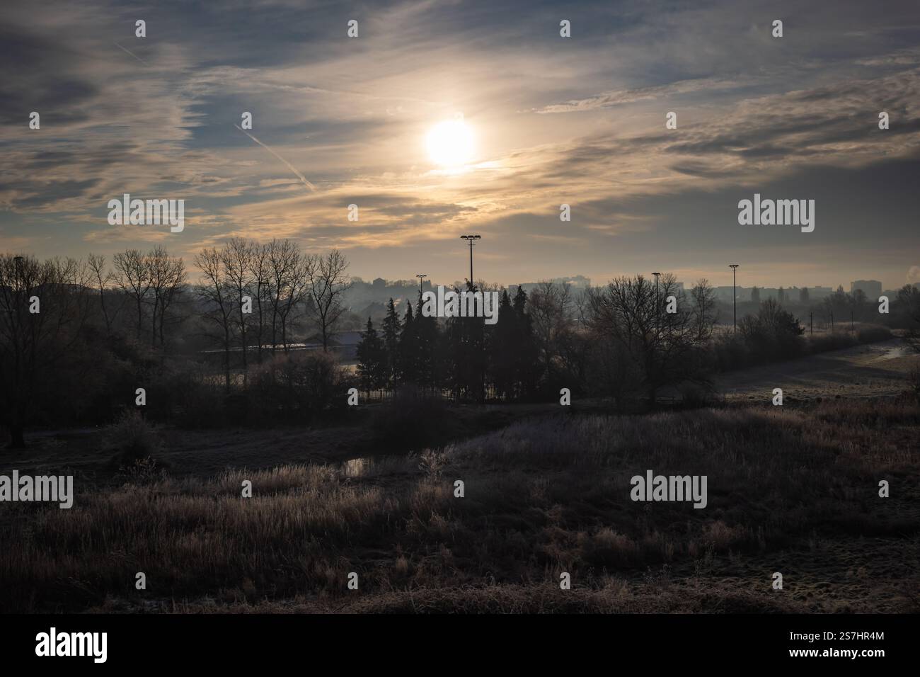Dried field on a cold frosty morning and a beautiful sunrise in england ...