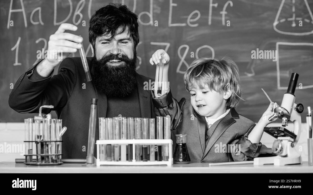 Back to school. Chemistry experiment. Teacher child test tubes. Kid ...