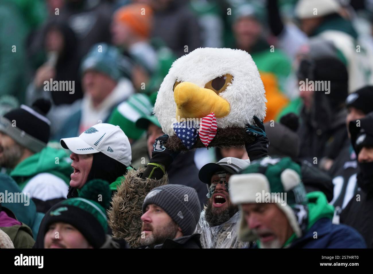 A Philadelphia Eagles' fan holds an eagle head before an NFL football ...