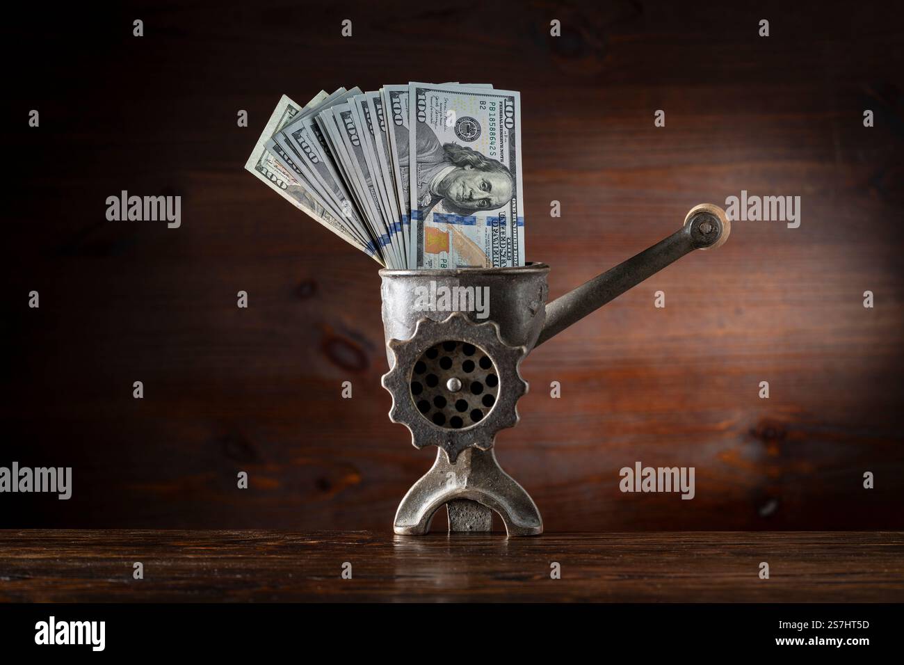 Lots of cash US 100 dollar bills banknotes in old meat grinder on ...