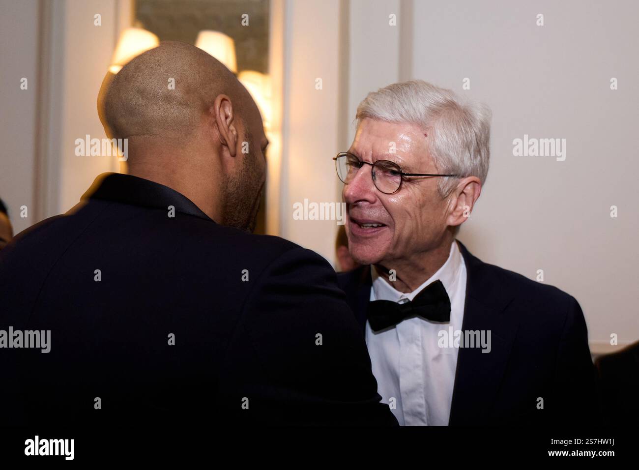 Former Arsenal manager Arsene Wenger (right) greets his former player ...