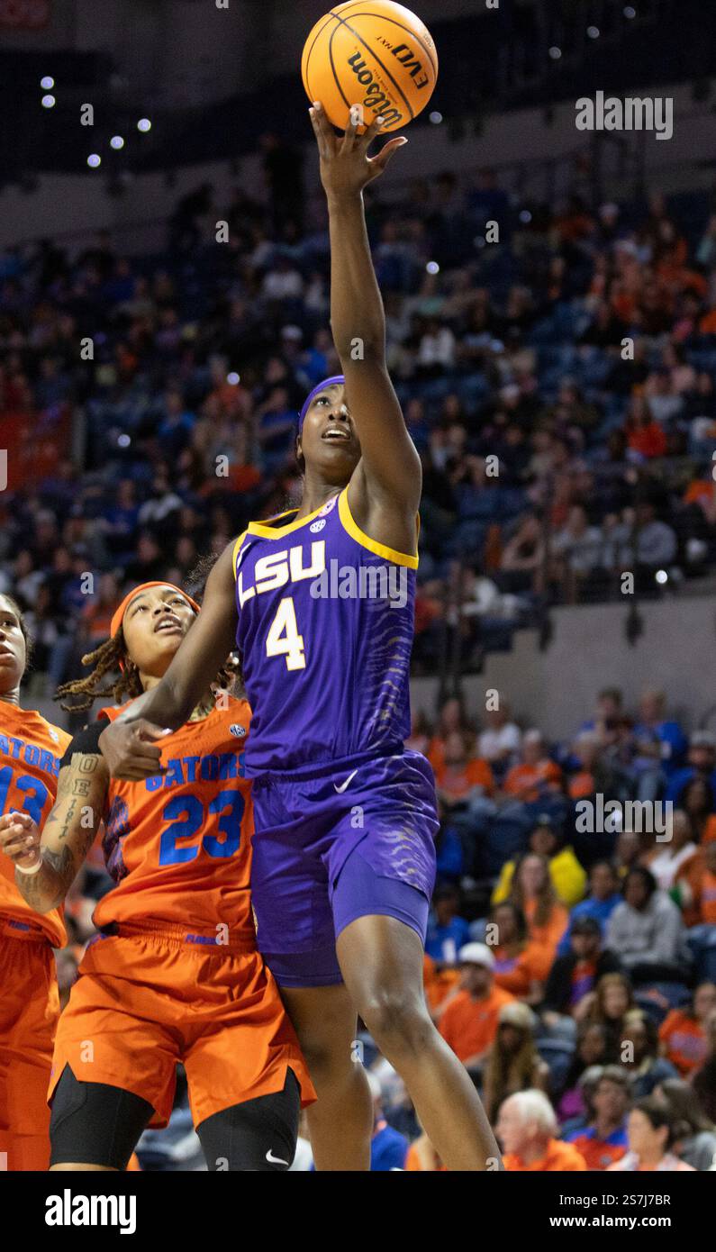 LSU guard Flau'Jae Johnson (4) shoots past Florida guard Liv McGill (23 ...