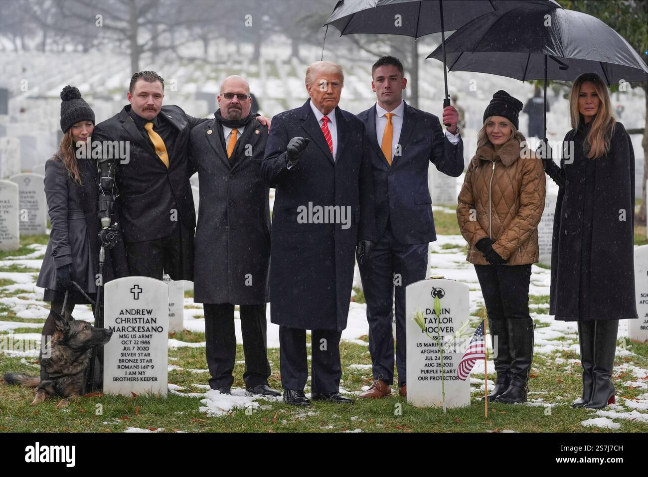 President-elect Donald Trump poses for a photo with the family of ...