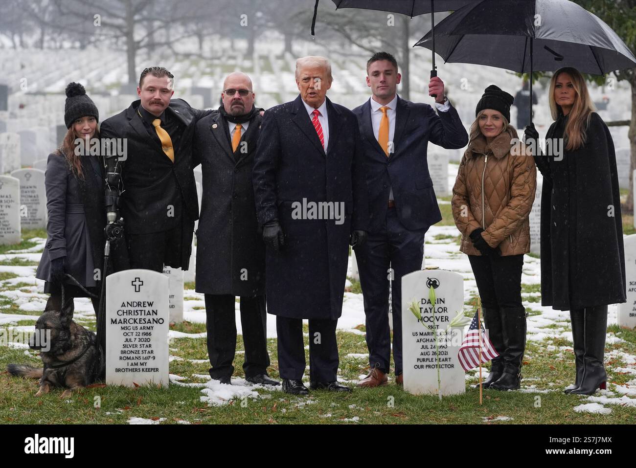 President-elect Donald Trump poses for a photo with the family of ...