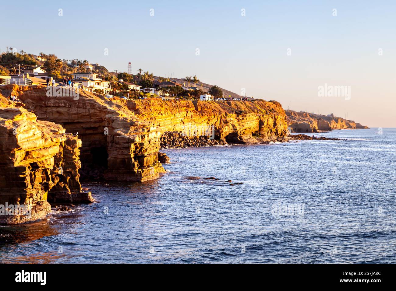 Majestic coastal shoreline come alive in the golden glow of sunset ...
