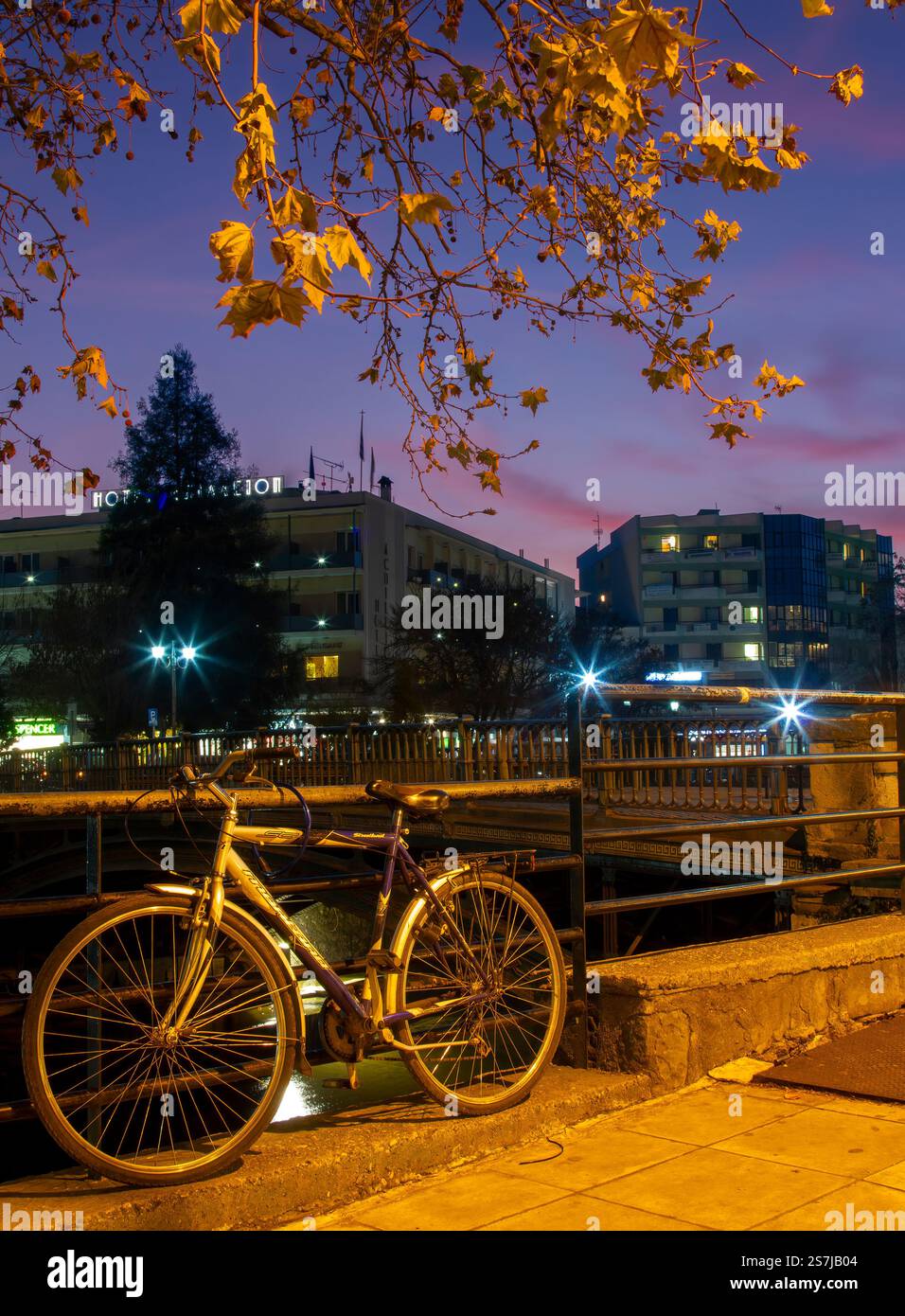 Twilight descends on the charming town of Trikala, Greece, with a ...