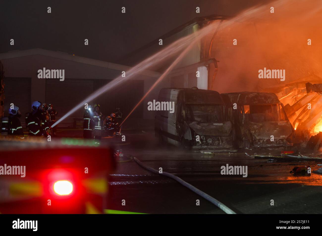 Wuppertal, Germany. 19th Jan, 2025. Burnt-out vans stand in front of a ...
