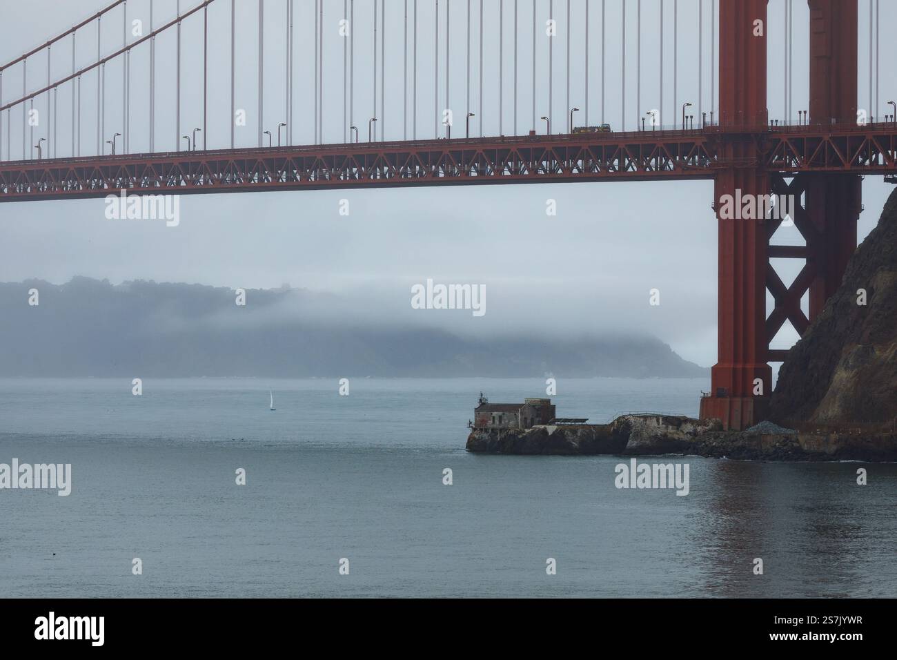 Fog surrounds Lime Point Lighthouse under north tower of the golden ...