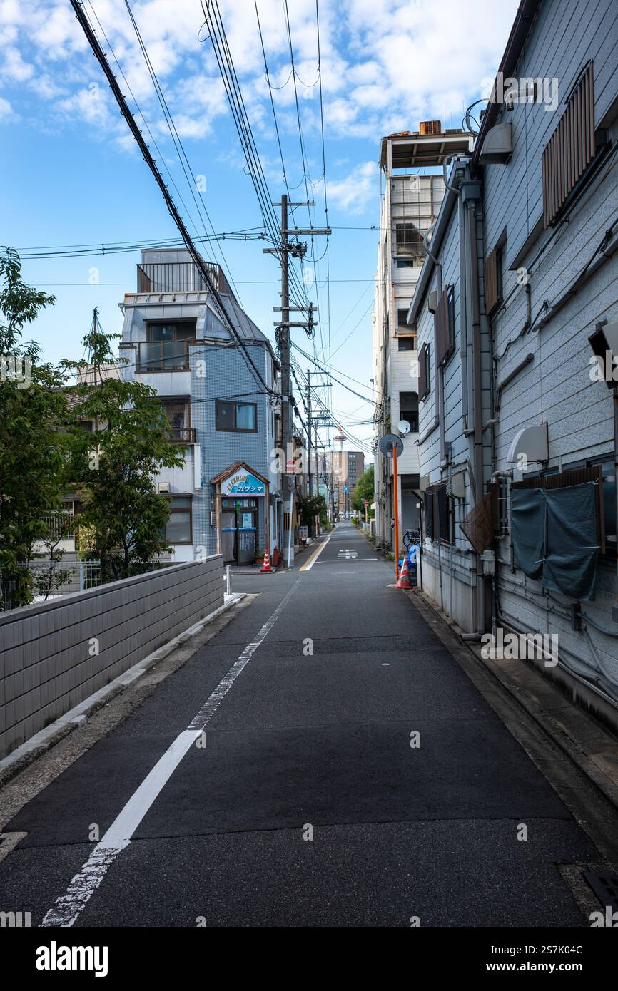 Back Street Alley in Southern Kyoto with Kyoto Tower in the distance in ...