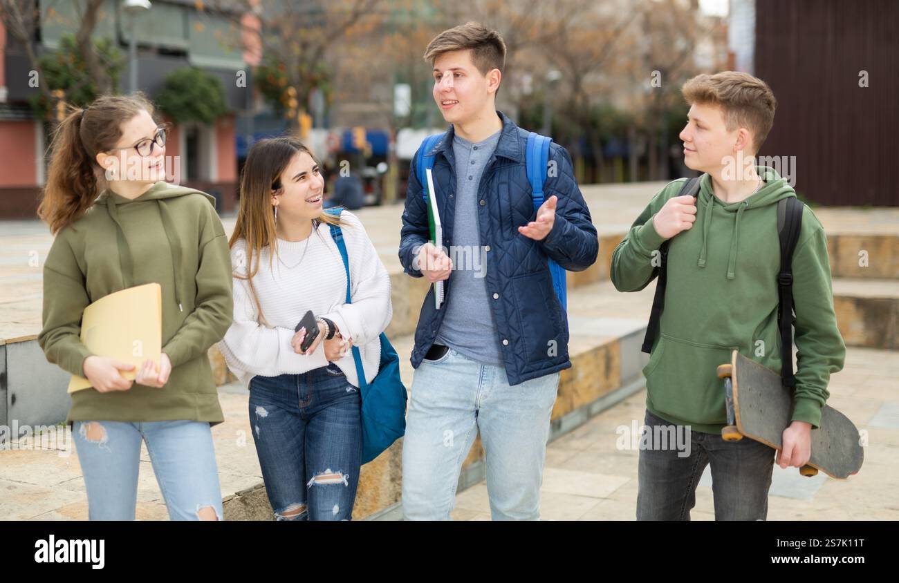 Teenage students talking outside after lessons Stock Photo - Alamy