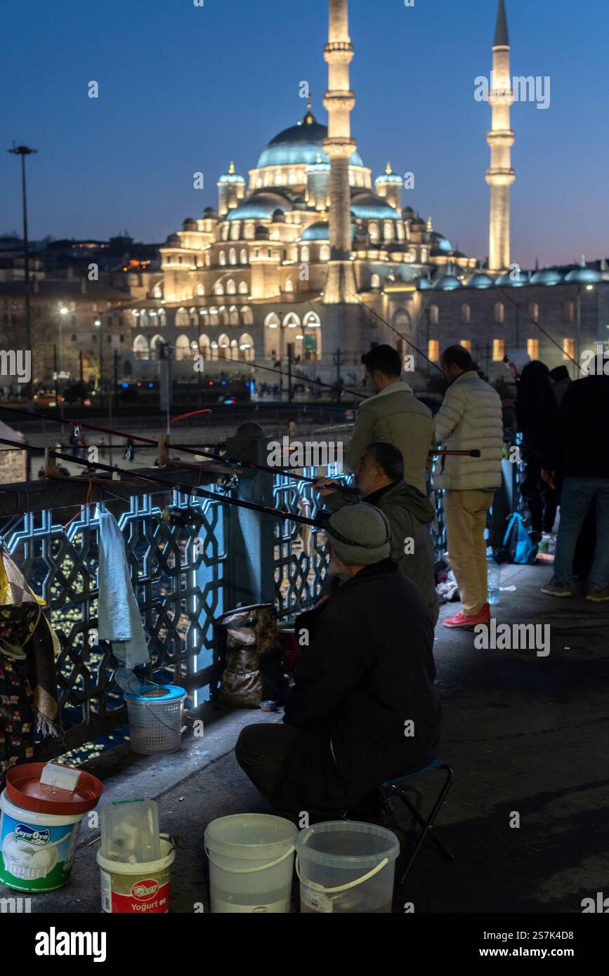 Istanbul, Turkey. January 3rd 2025. Turkish men fishing at night from ...