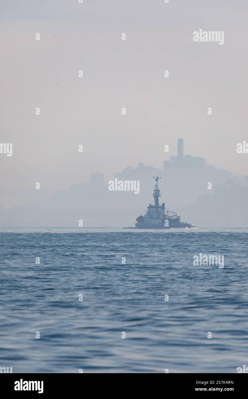 Tugboat passes in front of city front skyline of Francisco’s ...