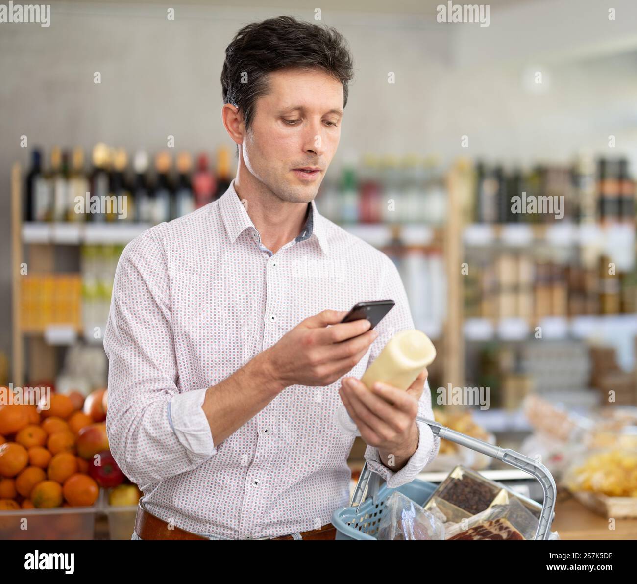 Man in light shirt scan QR code and take reading mayonnaise label using ...