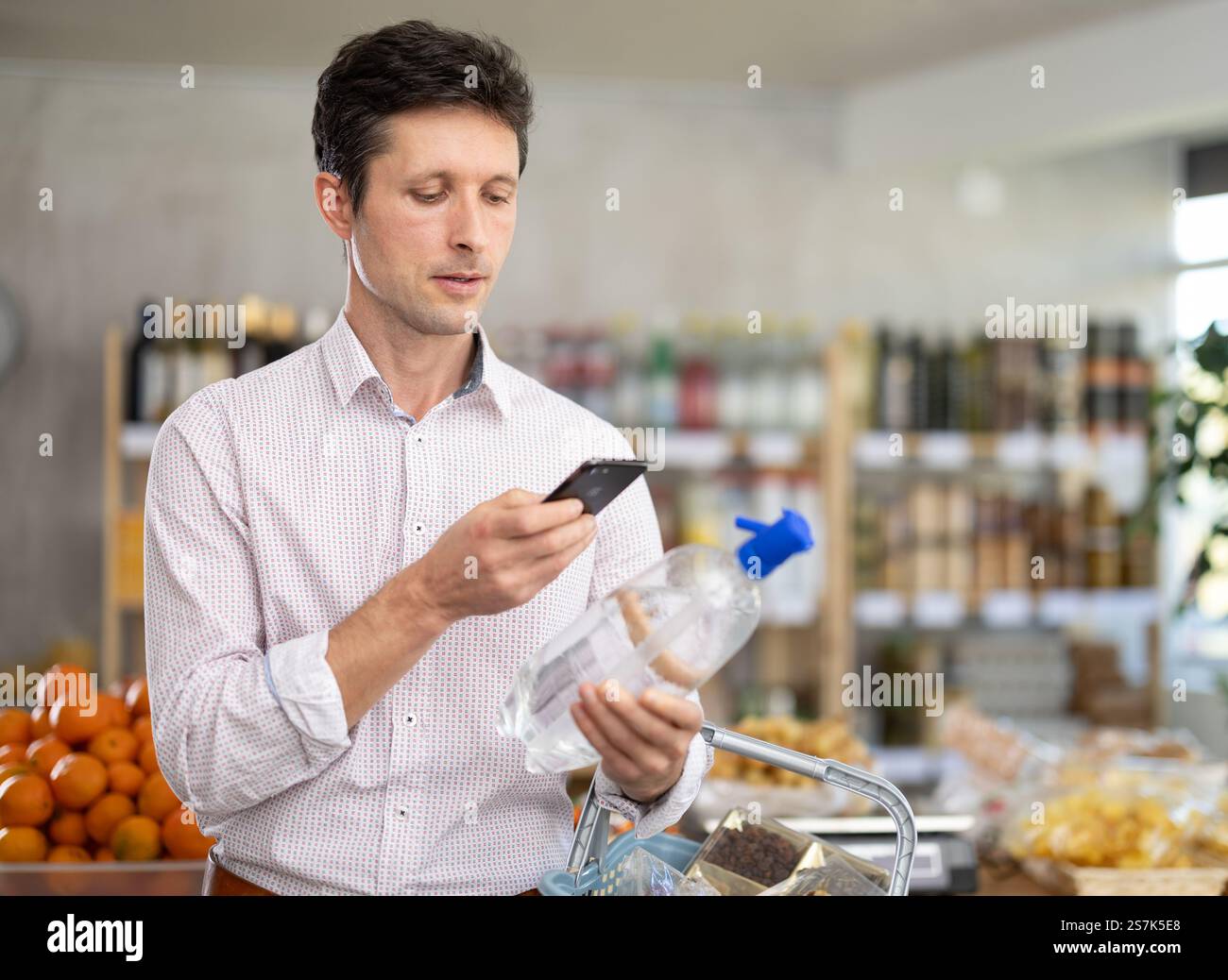 Man in light shirt scan QR code and take reading soda water label using ...