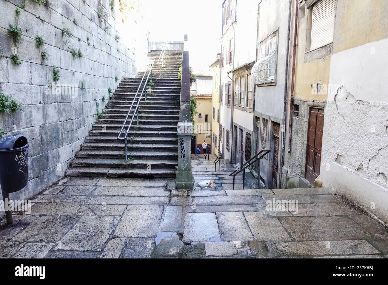 A narrow and steep staircase located in Porto, Portugal, designed for ...