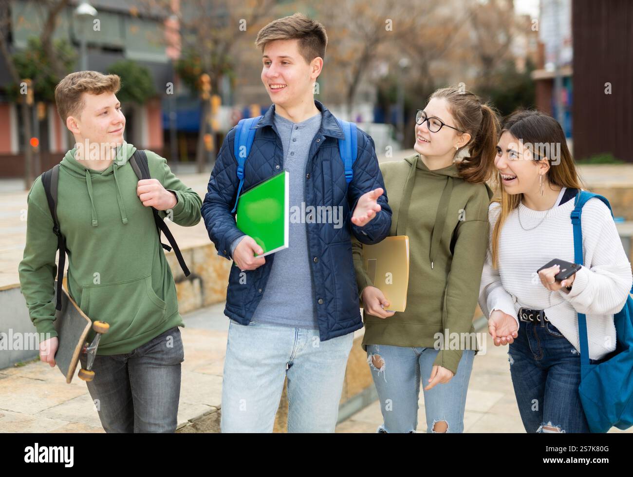 Teenage students talking outside after lessons Stock Photo - Alamy