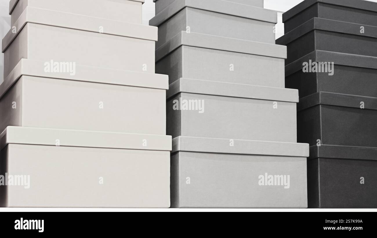 A stack of boxes with one being the tallest and the others being ...