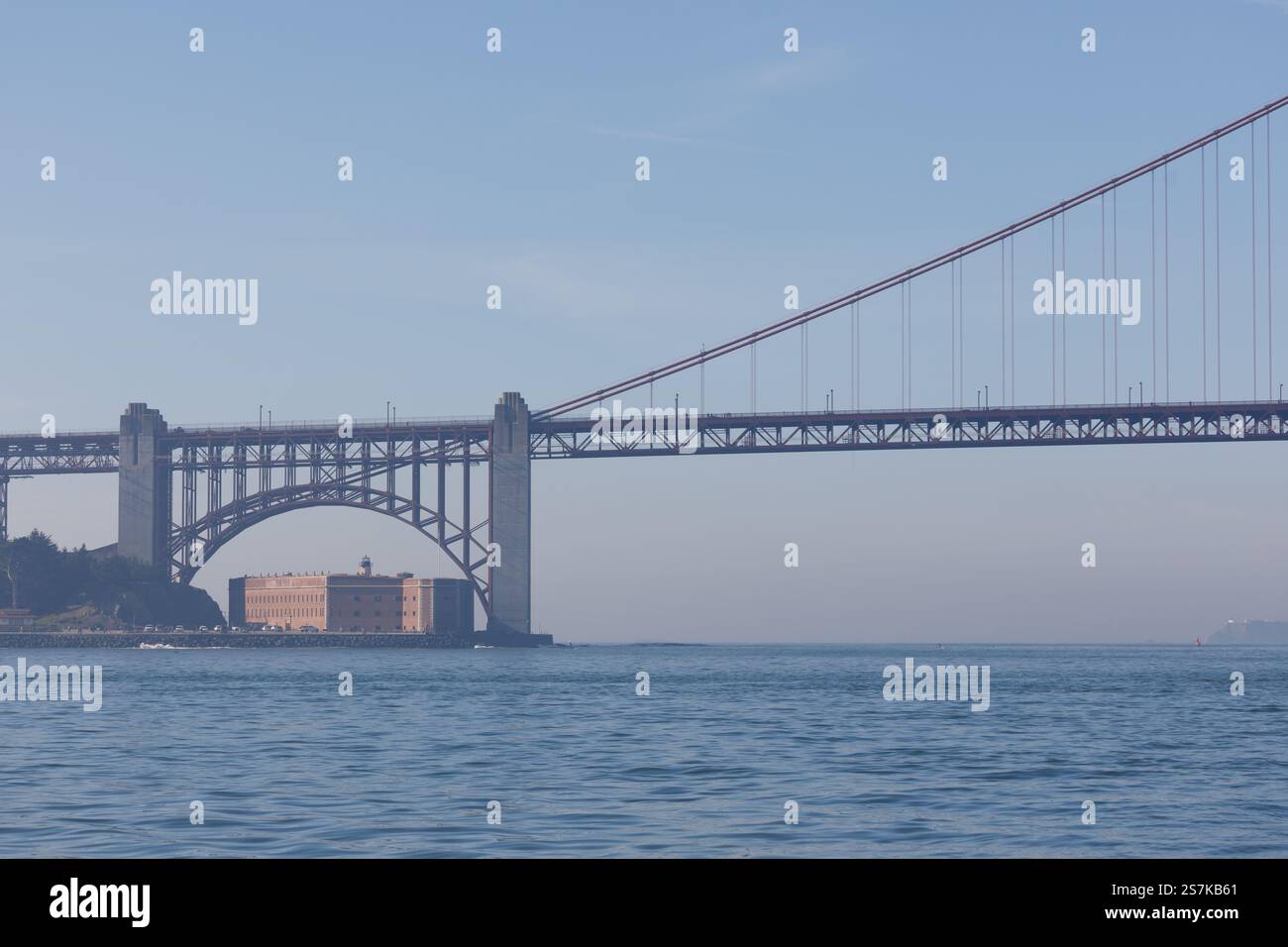 Water level view of Fort Point fortification under the long span of the ...