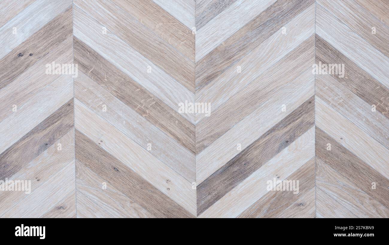 A wooden floor with a chevron pattern. The chevron pattern is made up ...