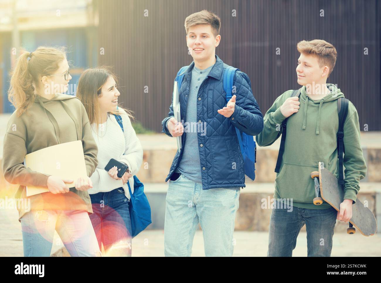 Teenage students talking outside after lessons Stock Photo - Alamy