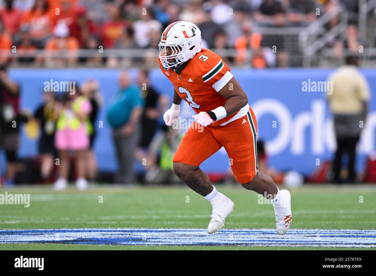 Miami defensive lineman Akheem Mesidor (3) follows a play against Iowa ...